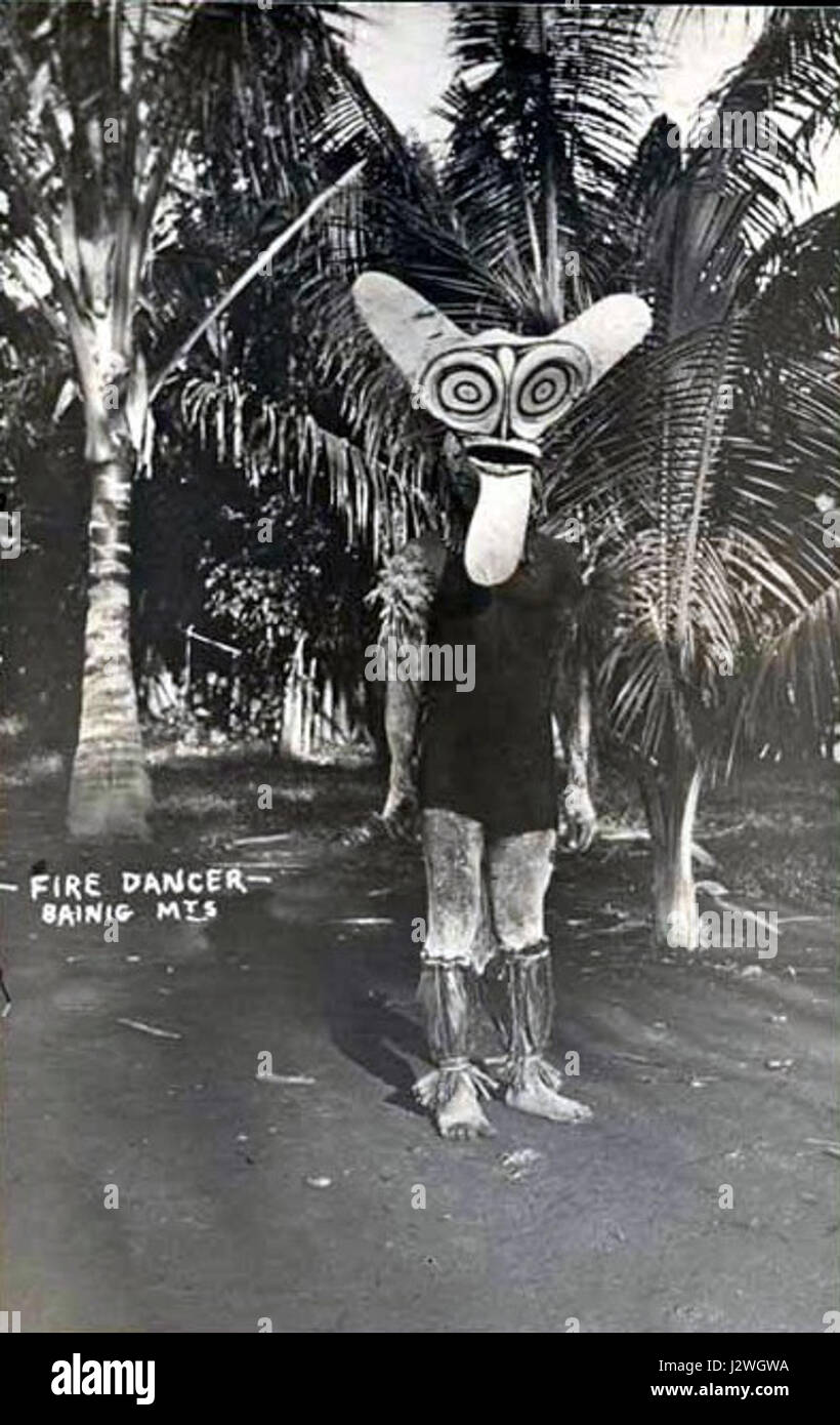 A Baining fire dancer from New Britain, Papua New Guinea, is captured ...