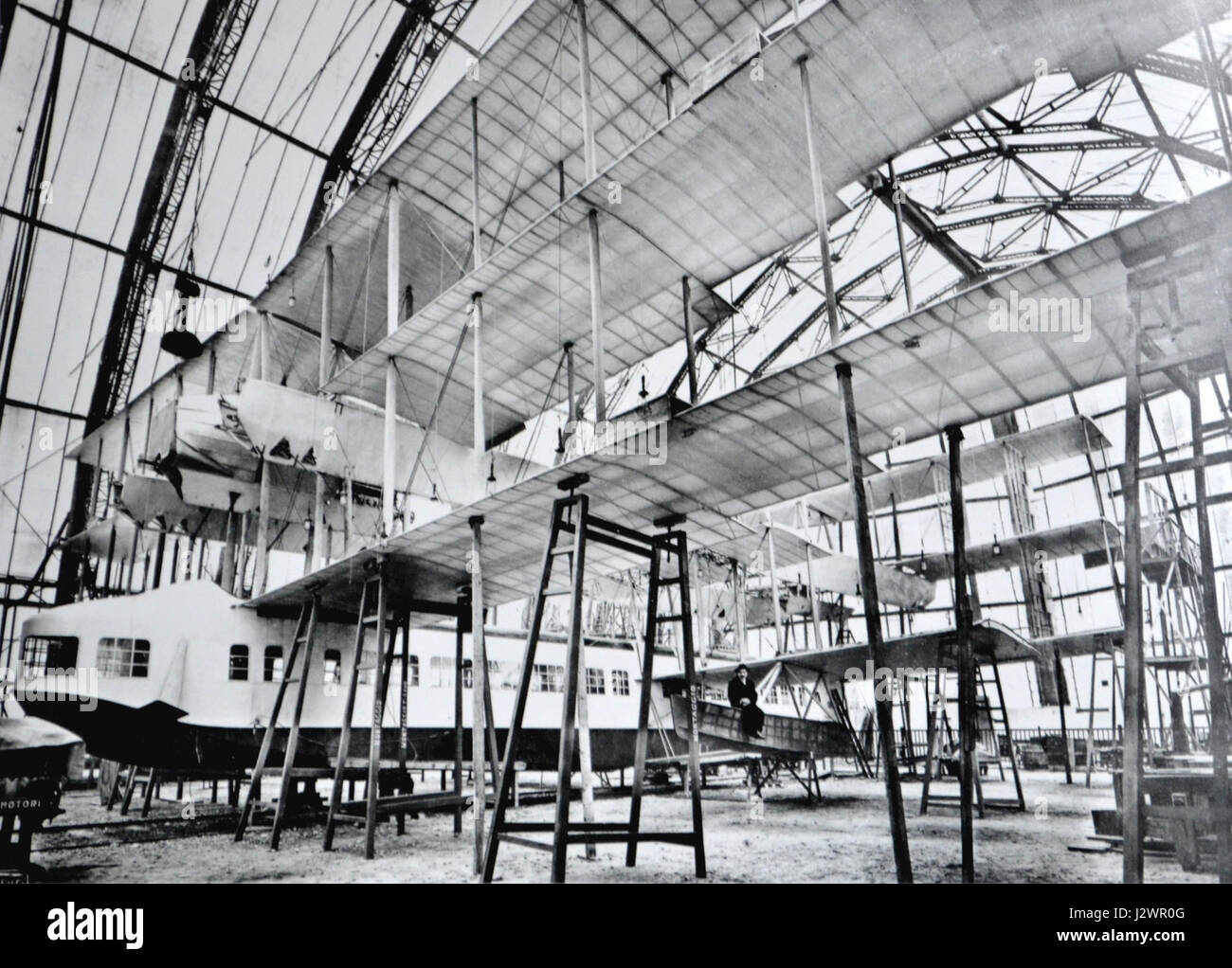 This image shows a plane, possibly from the 1960s, under construction ...