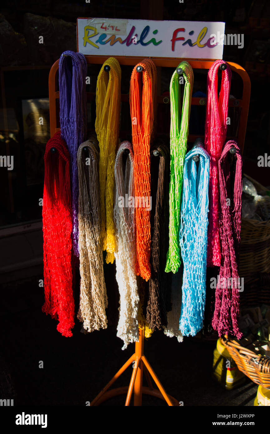 Empty mesh bags of various color at a market place Stock Photo - Alamy