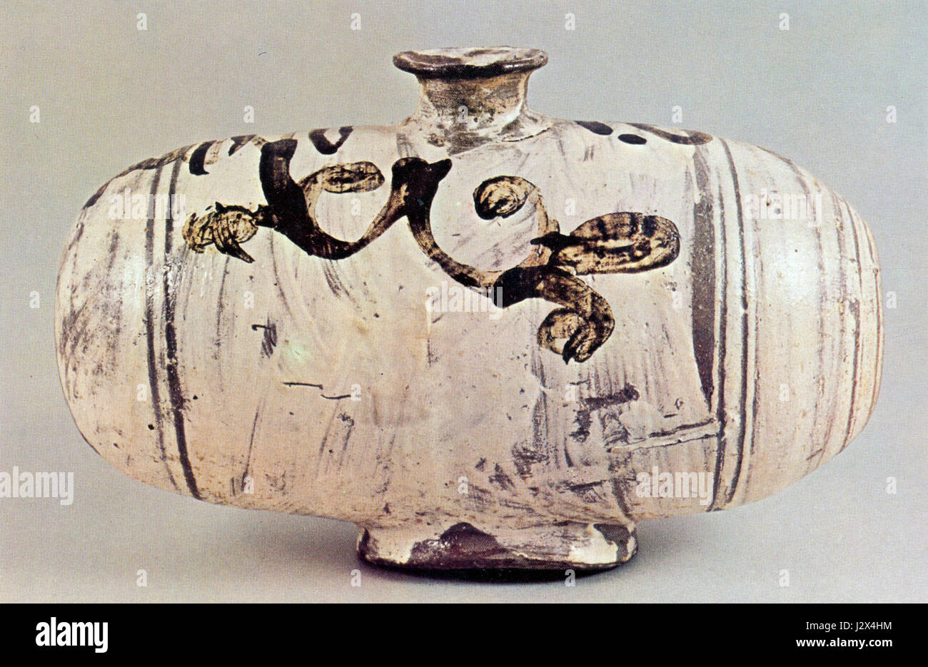 This Buncheong barrel-shaped vessel from Korea features an underglaze ...