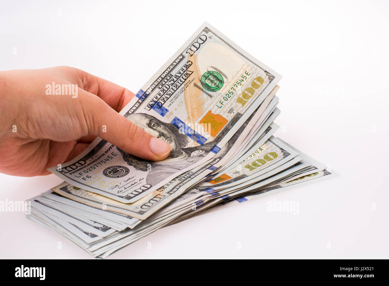 Human hand holding American dollar bill as money isolated on white ...