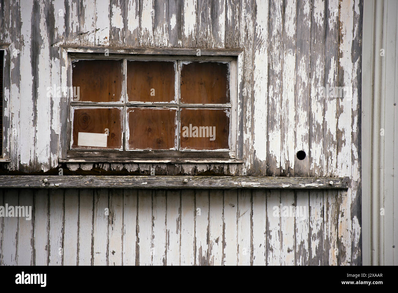Old window of old wooden building boards chipped and peeling painted ...