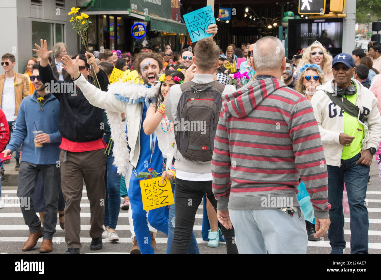 New York City, USA. 30th Apr, 2017. Love Day attendees parade along ...