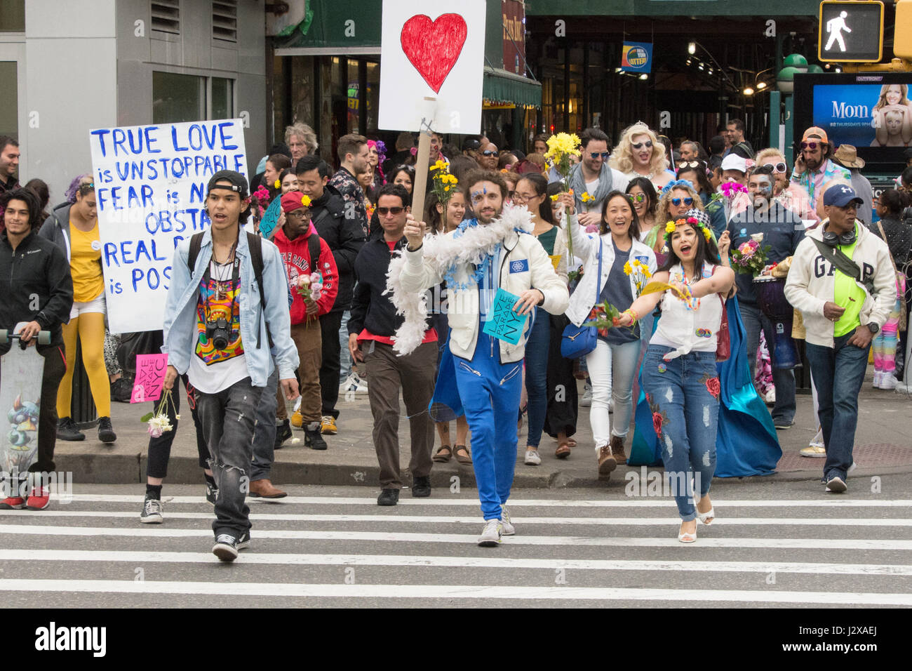 New York City, USA. 30th Apr, 2017. Love Day attendees parade along ...