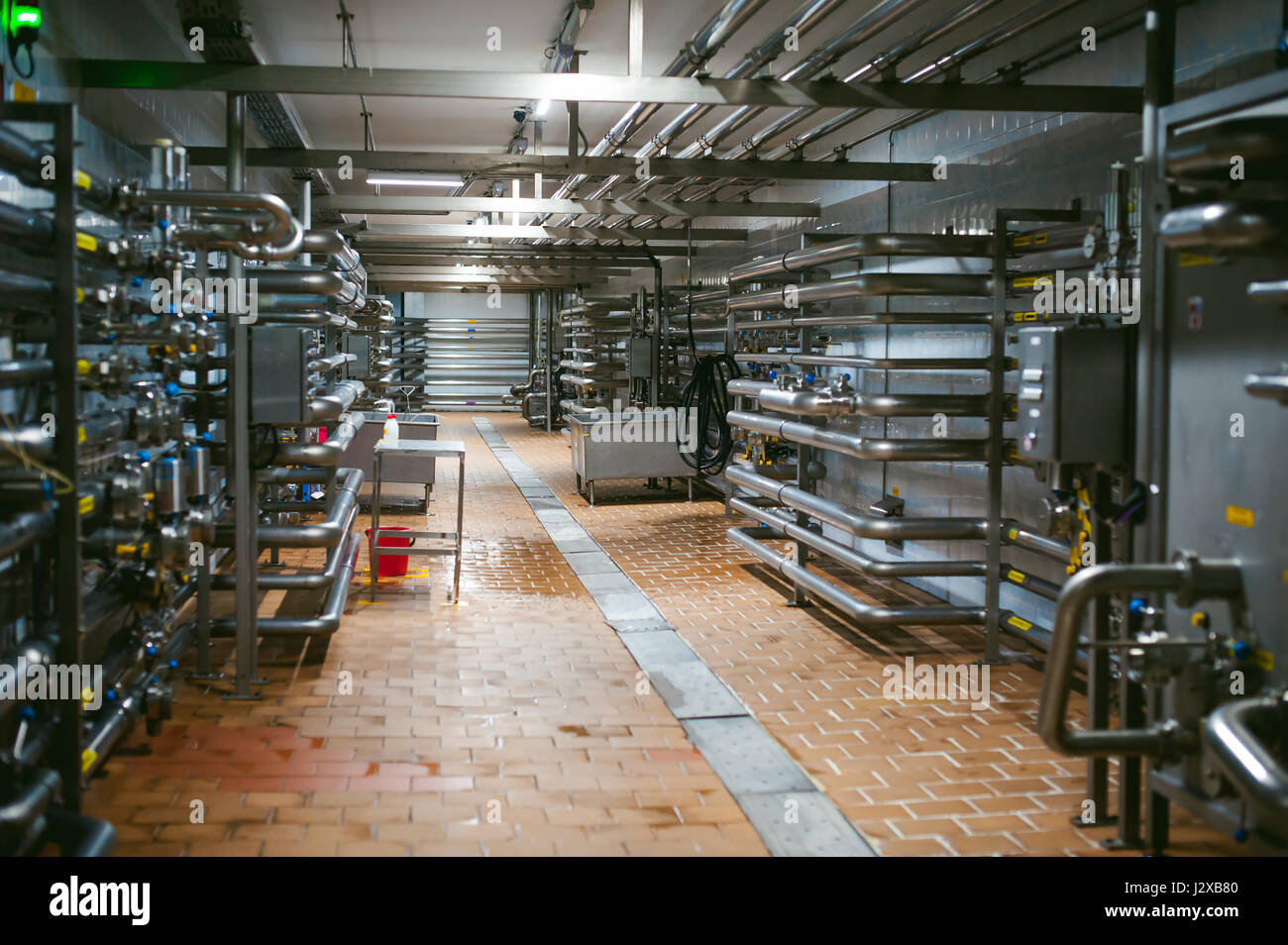 Corridor in a production building with metal pipes at the brewery Stock ...