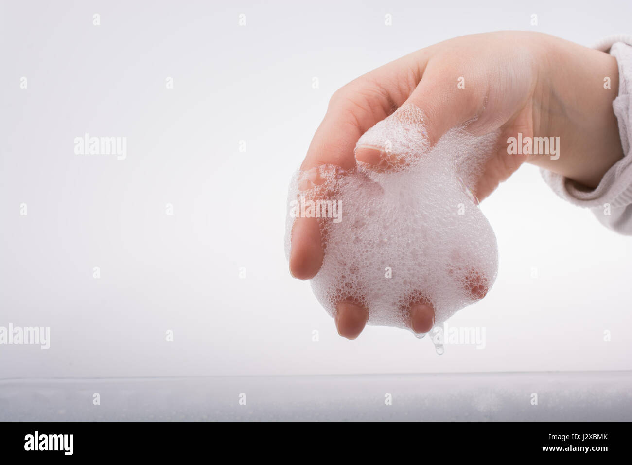 Hand washing and soap foam on a foamy background Stock Photo - Alamy