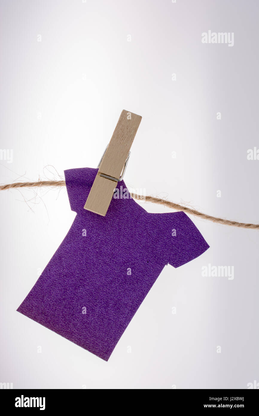 Paper clothes hang on a rope with the help of clothespins Stock Photo ...