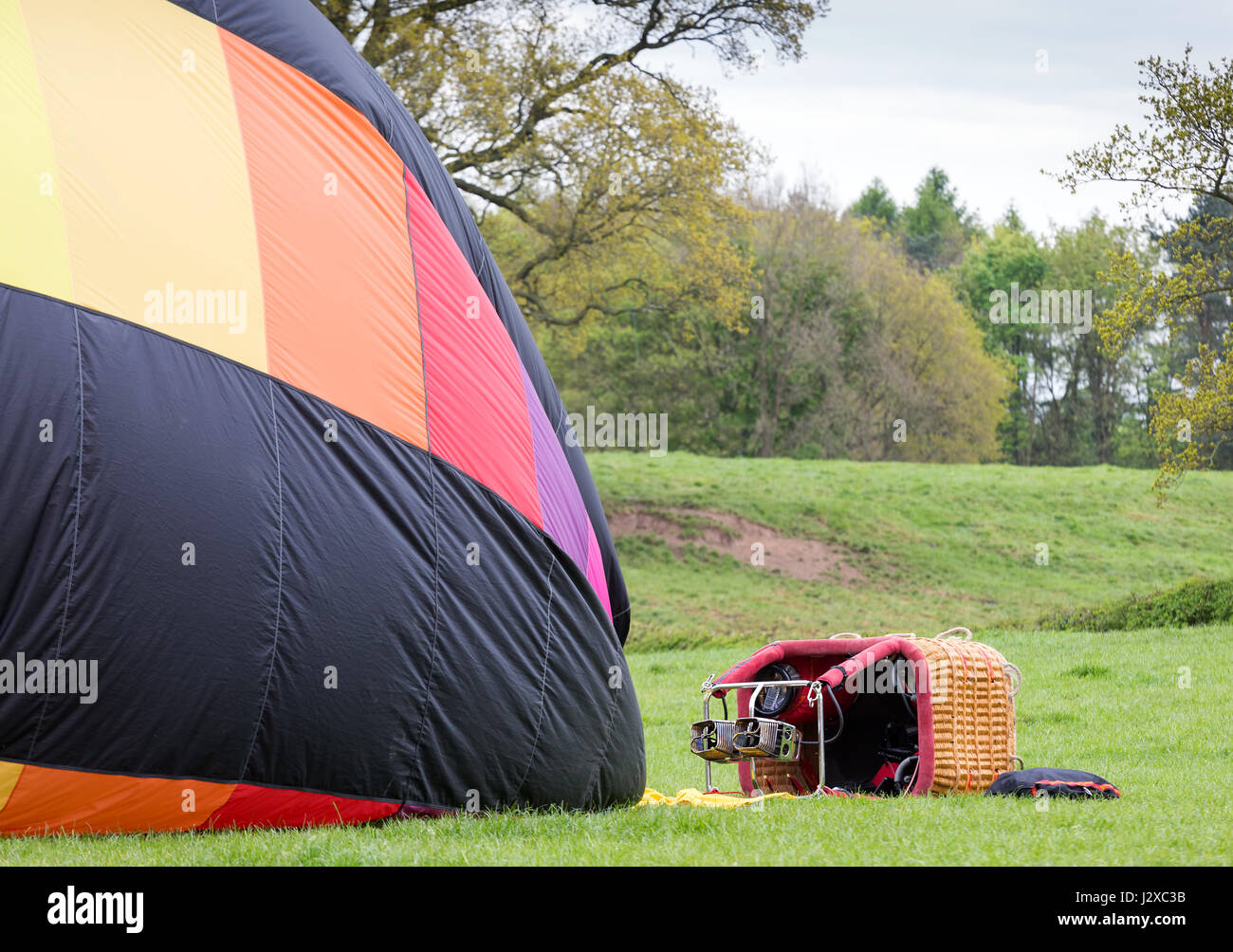 Hot air balloon lying on its side soon after landing Stock Photo - Alamy