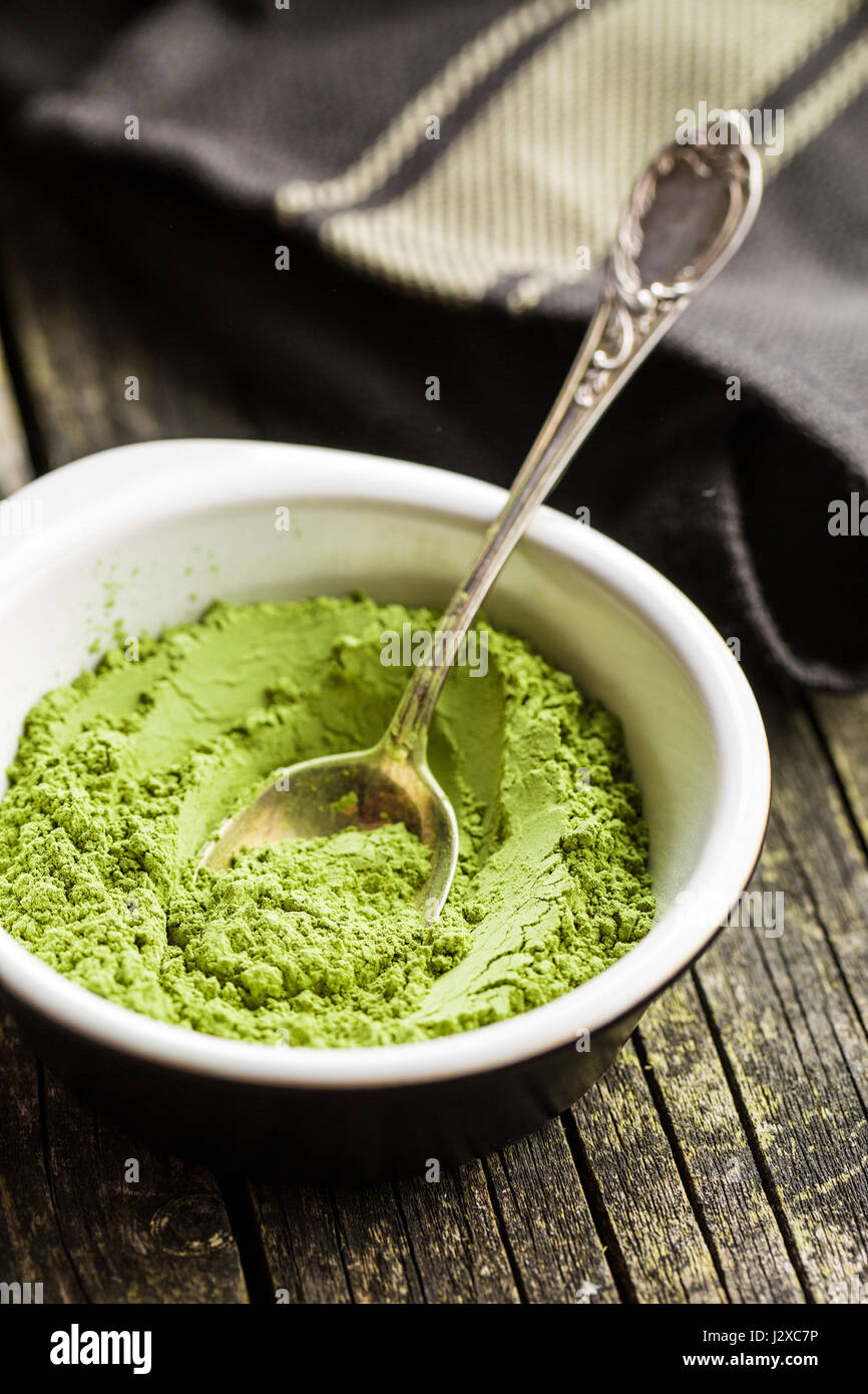 Green matcha tea powder in bowl Stock Photo - Alamy