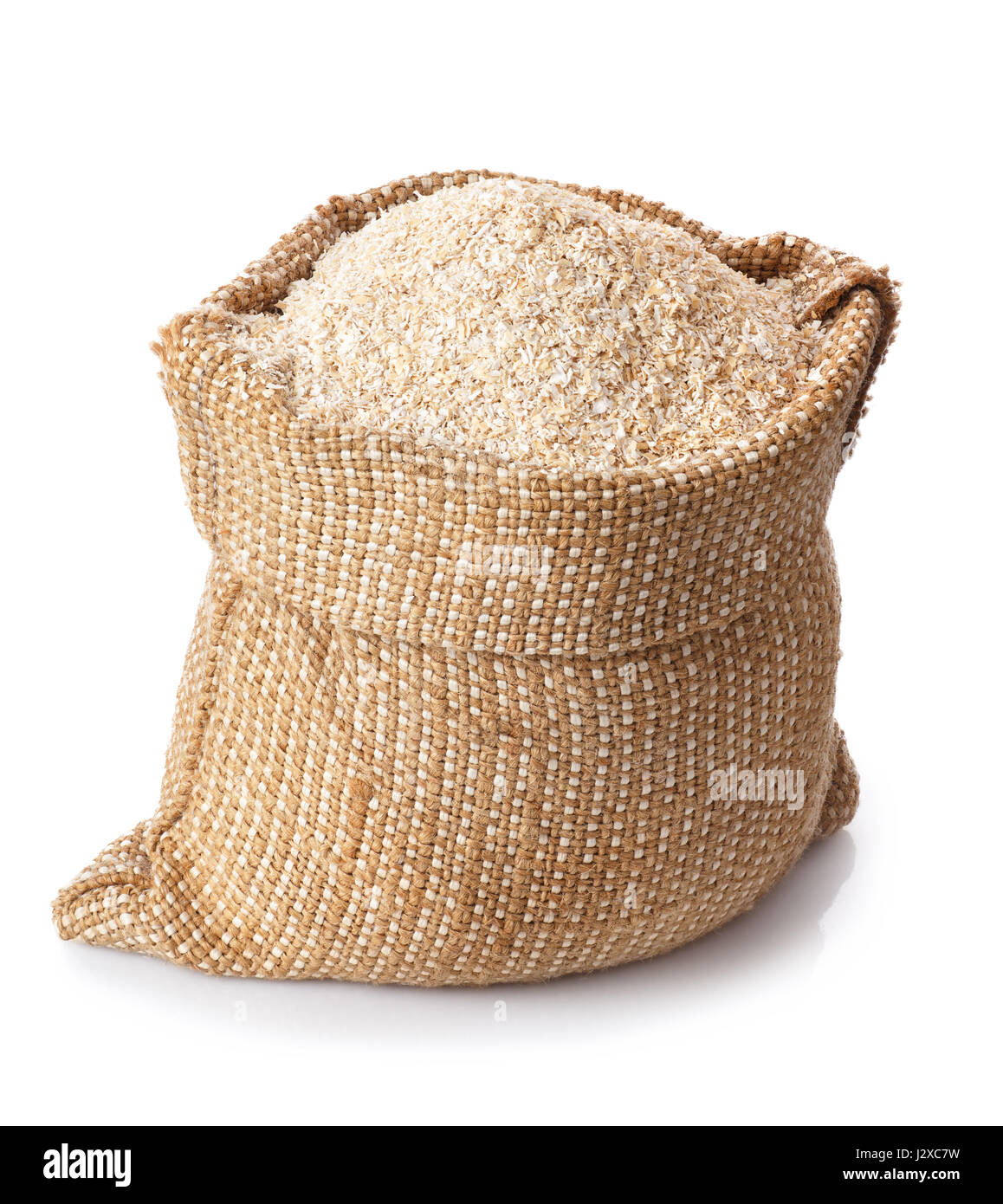 bran in burlap bag isolated on white background. Food supplement to ...
