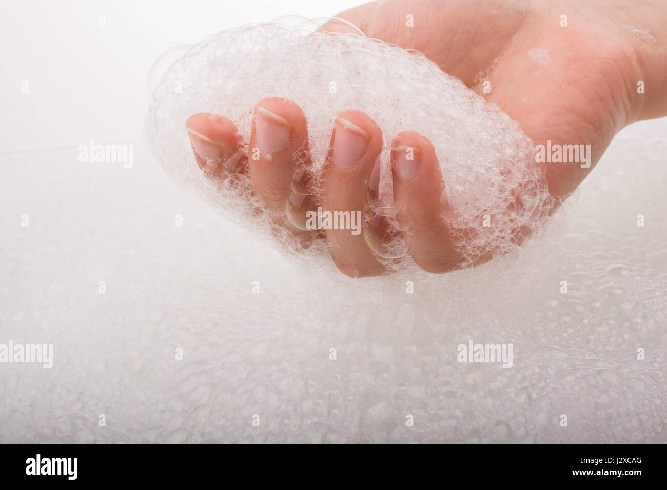 Hand washing and soap foam on a foamy background Stock Photo - Alamy