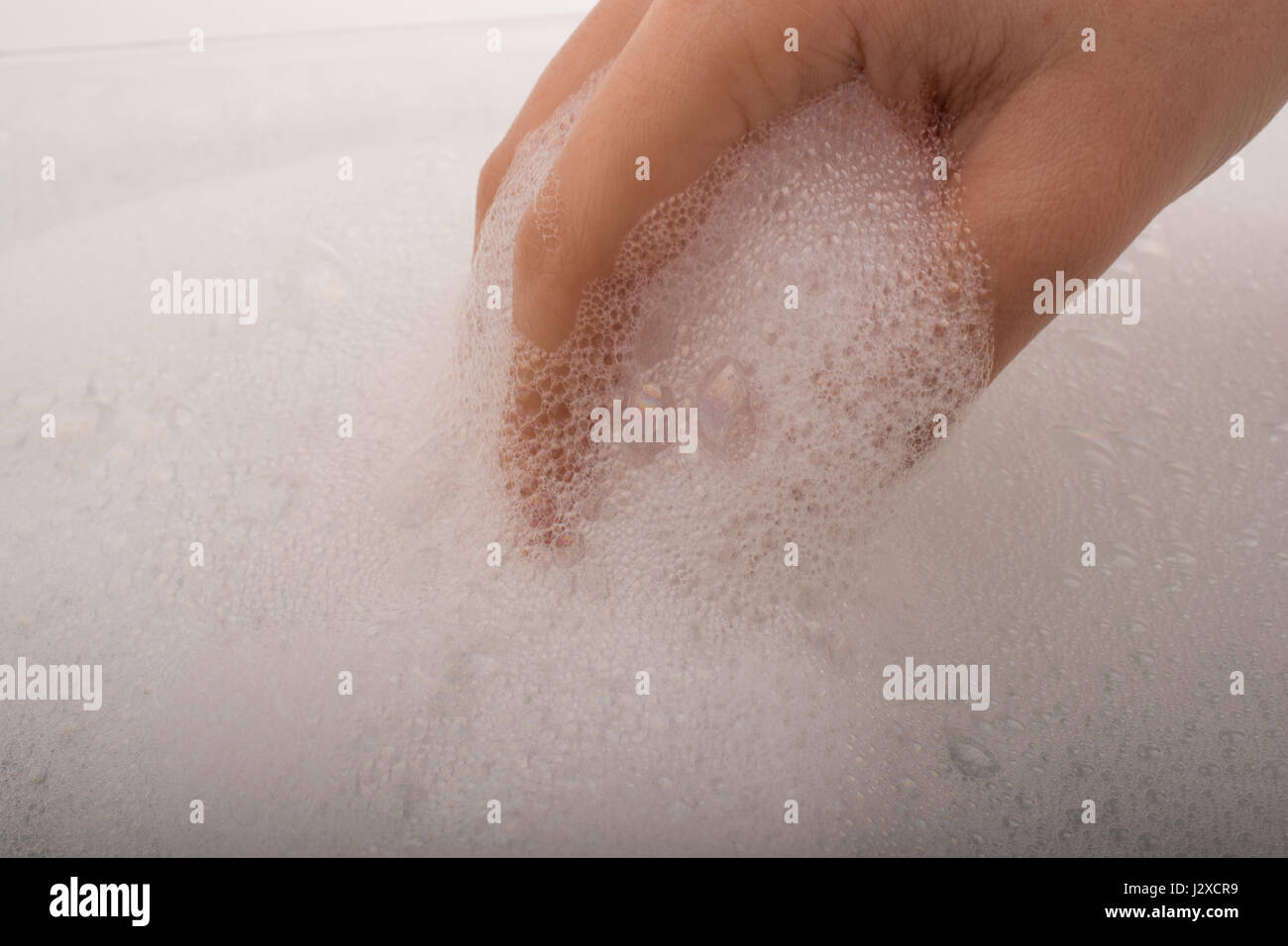Hand washing and soap foam on a foamy background Stock Photo - Alamy