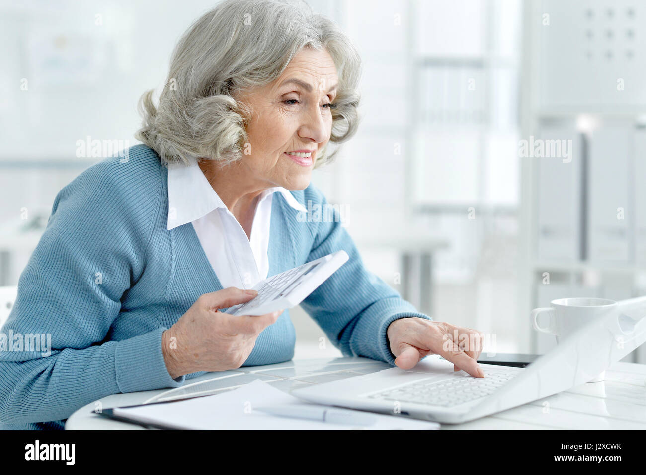 Elderly businesswoman working Stock Photo - Alamy