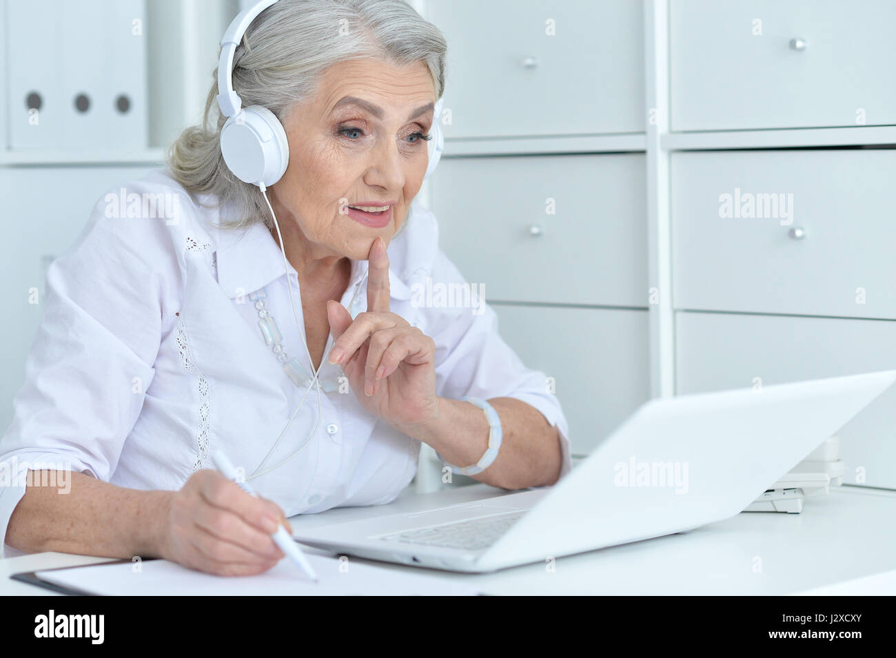 Elderly businesswoman working Stock Photo - Alamy