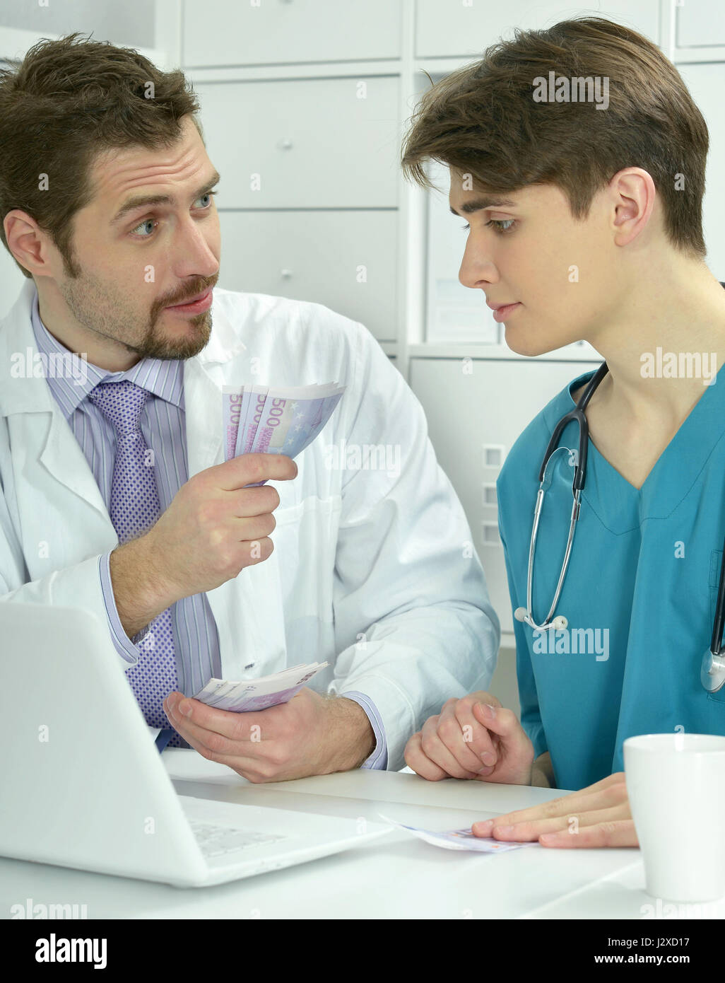 Handsome male doctor working laptop hi-res stock photography and images ...
