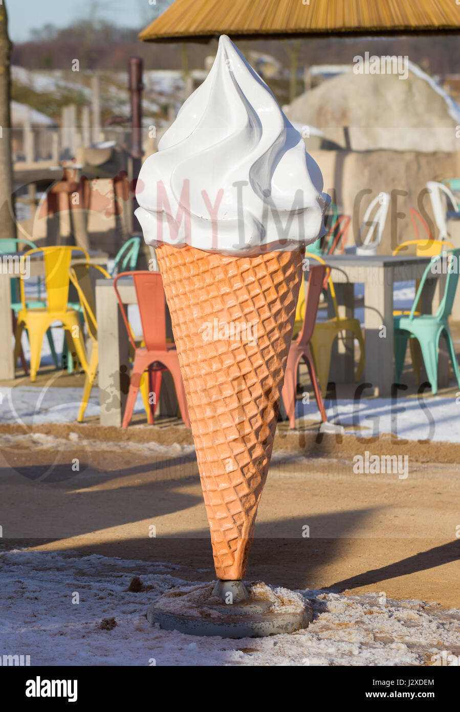 Ice cream cone in front of an ice cream bar Stock Photo - Alamy
