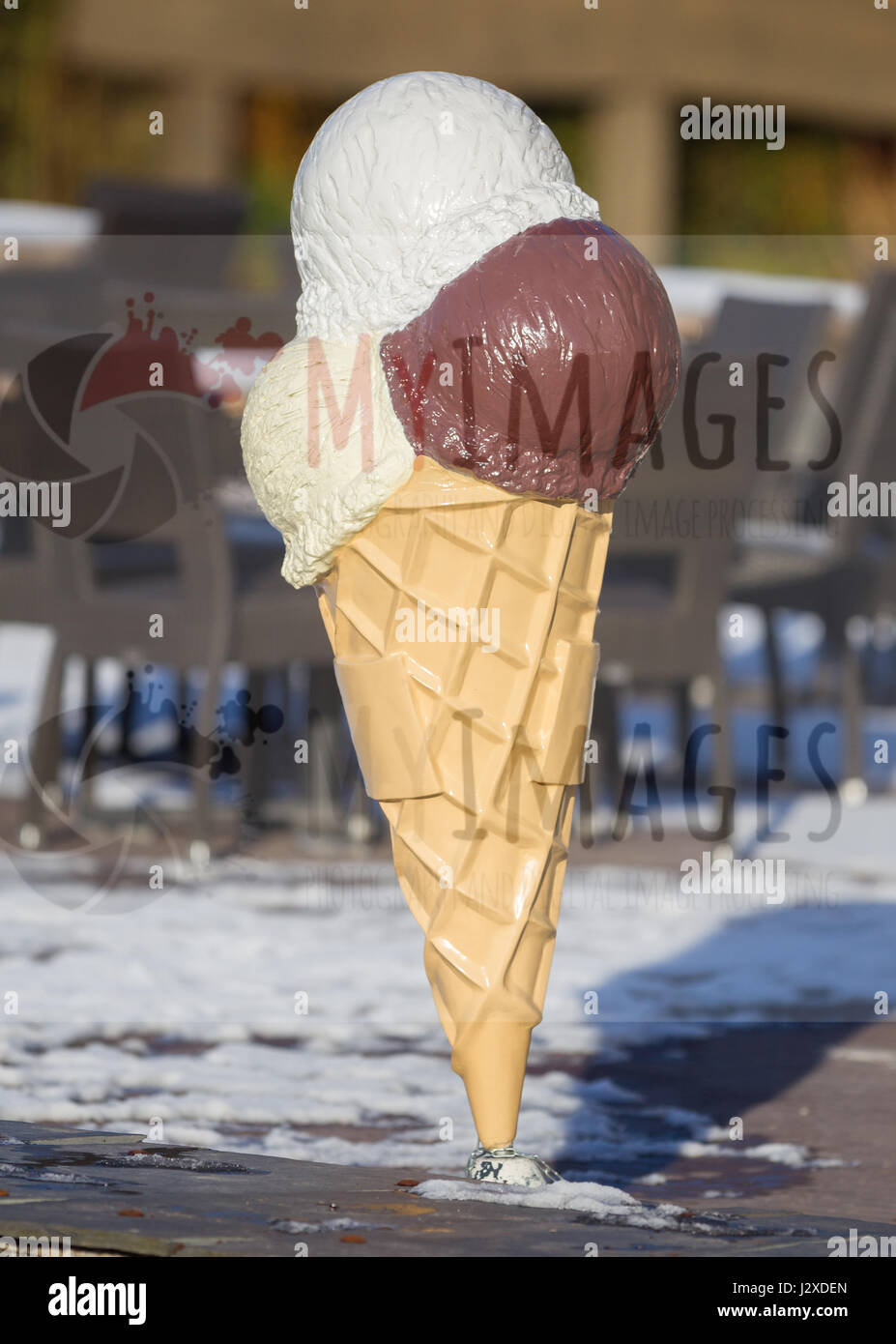 Ice cream cone in front of an ice cream bar Stock Photo - Alamy