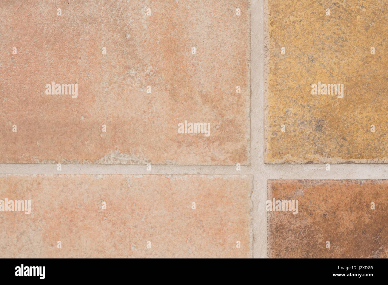 Floor tile close up, red with orange Stock Photo - Alamy