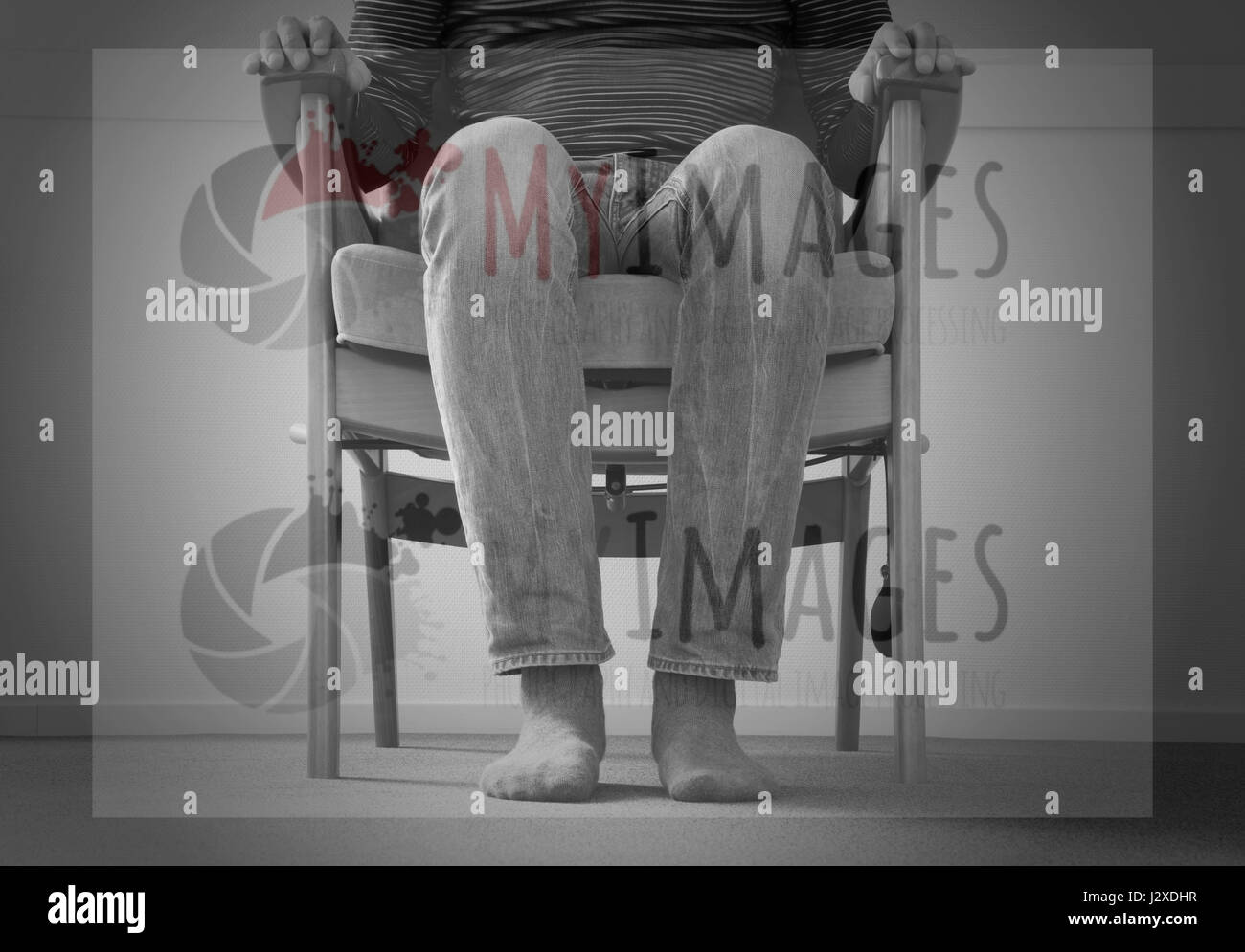 Man sitting in armchair, slightly creepy setting Stock Photo - Alamy