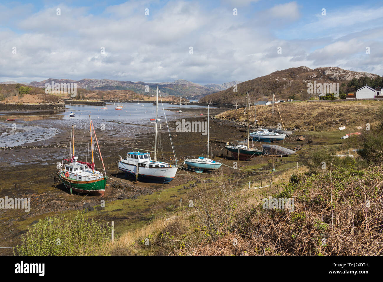 Boats at anchor at the former fishing village of Badachro, in the North ...