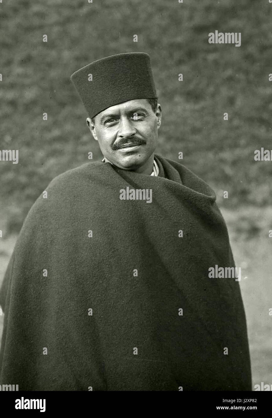 The Algerian burnous is a traditional hooded cloak worn by men in North ...