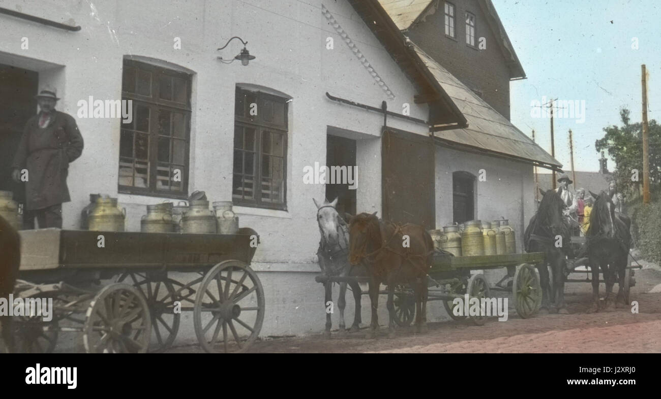 The image 'At the Cooperative Butter Factory' depicts a scene of dairy ...