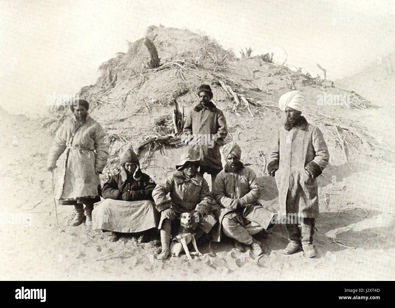 Aurel Stein, a famous archaeologist, is depicted with his dog, possibly ...