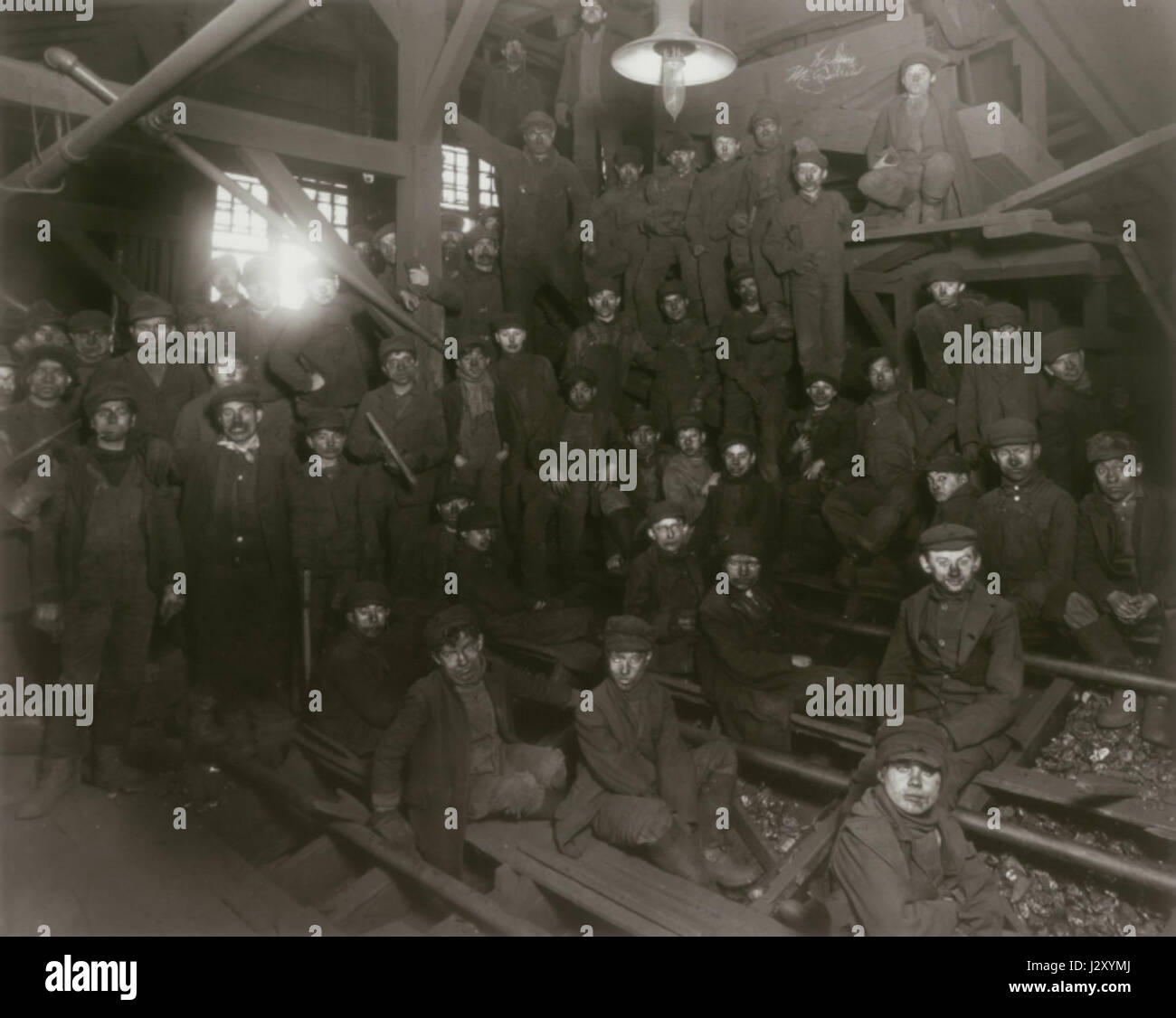 This photograph by Lewis Hine captures the lives of breaker boys ...