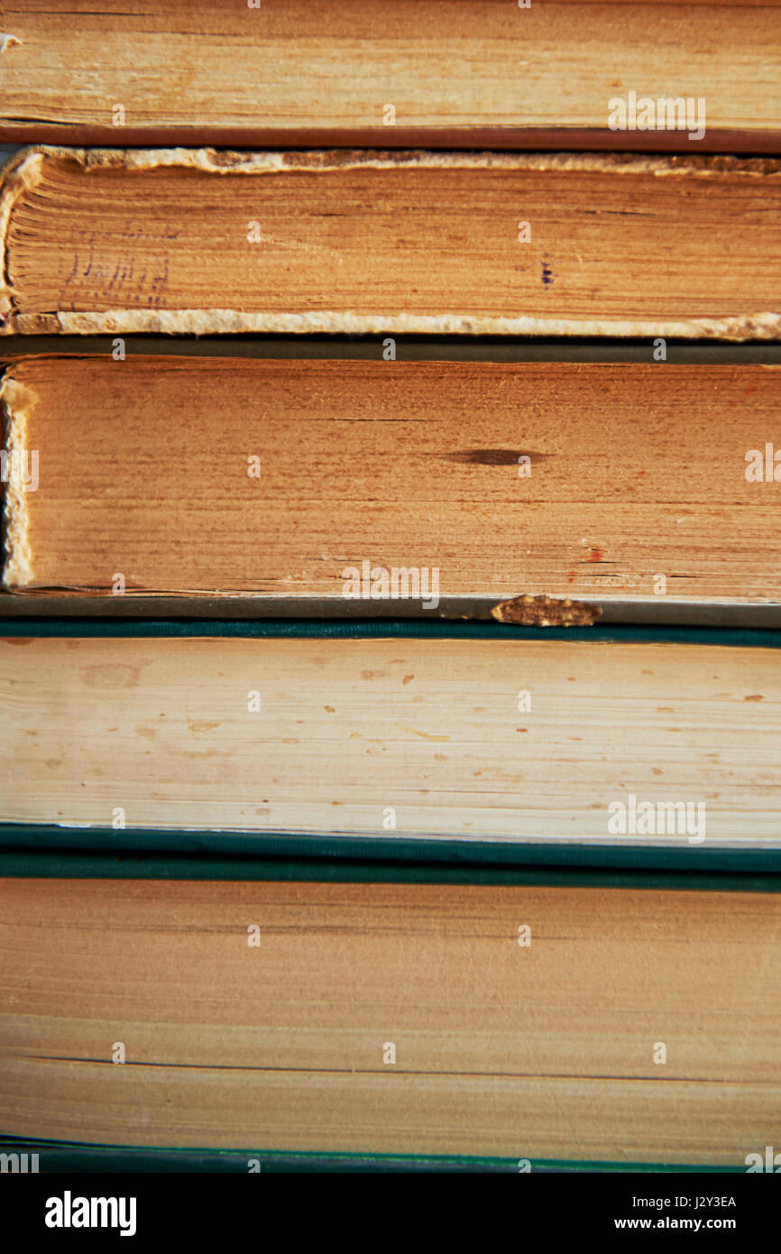 the texture is a stack of old books. Texture or background. Close up ...