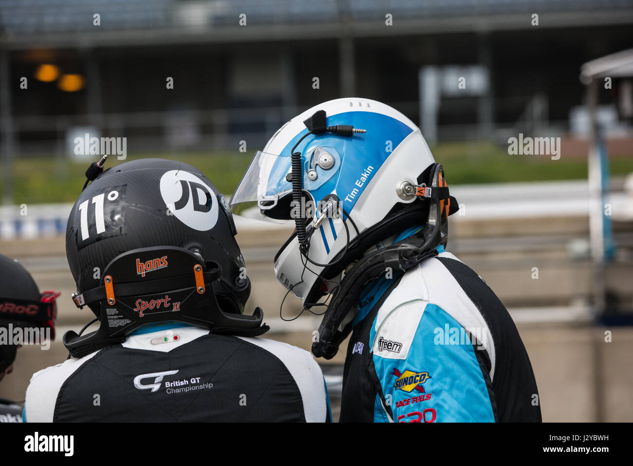 Tim Eakin talking to his team mate Kelvin Fletcher in the pit lane at ...