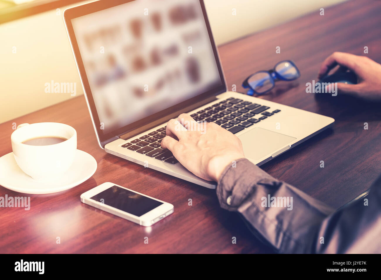 Young business man hand using computer laptop in the office with ...