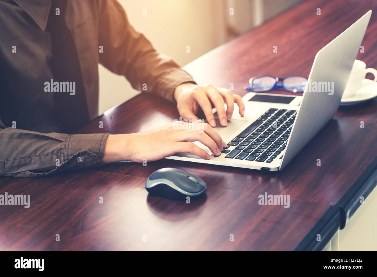 Young business man hand using computer laptop in the office with ...
