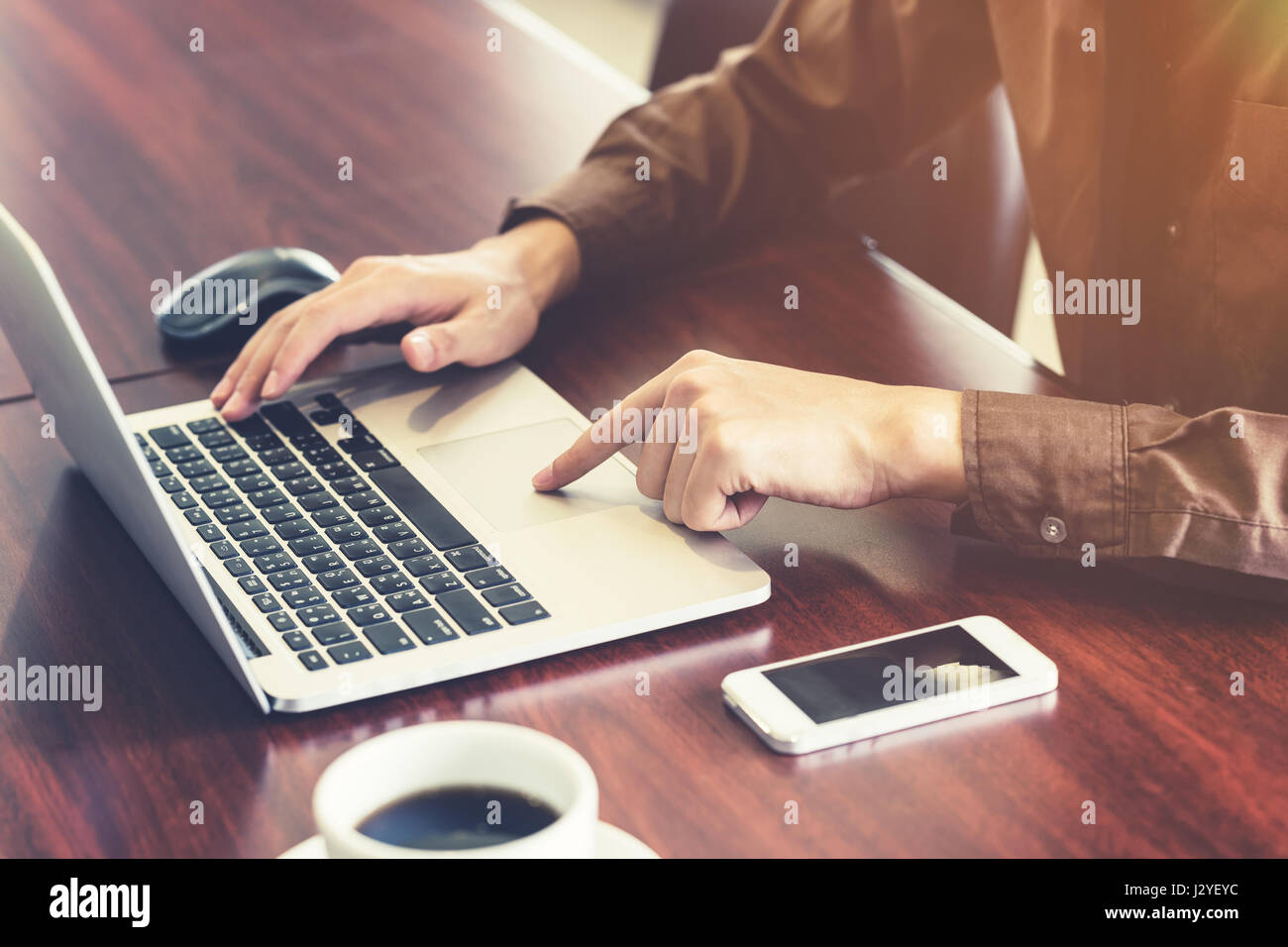 Young business man hand using computer laptop in the office with ...