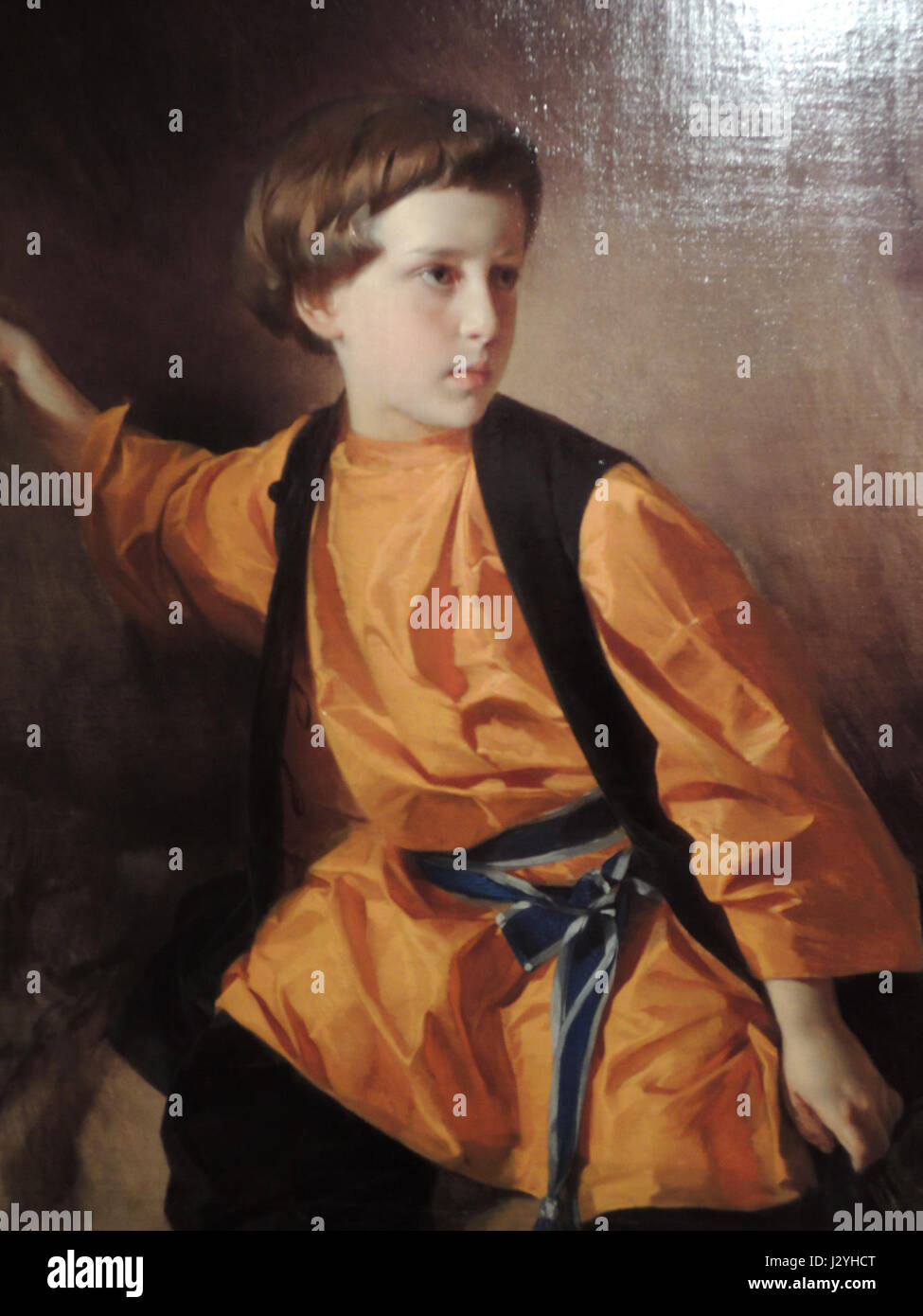 Boy in orange shirt by I.Makarov (1890s) detail Stock Photo - Alamy