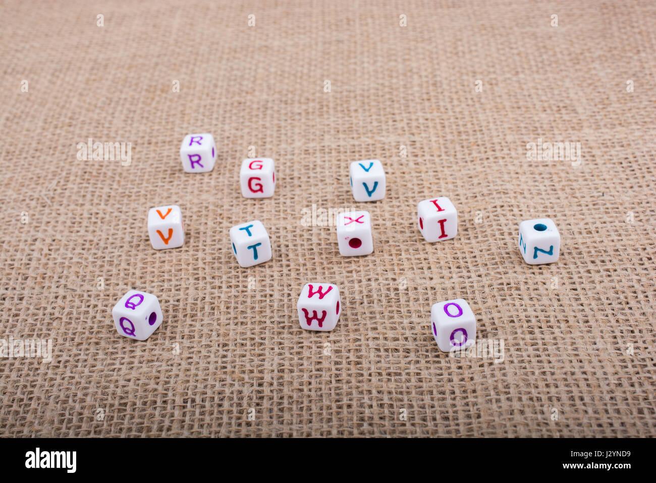 Colorful alphabet letter cubes on a linen canvas Stock Photo - Alamy
