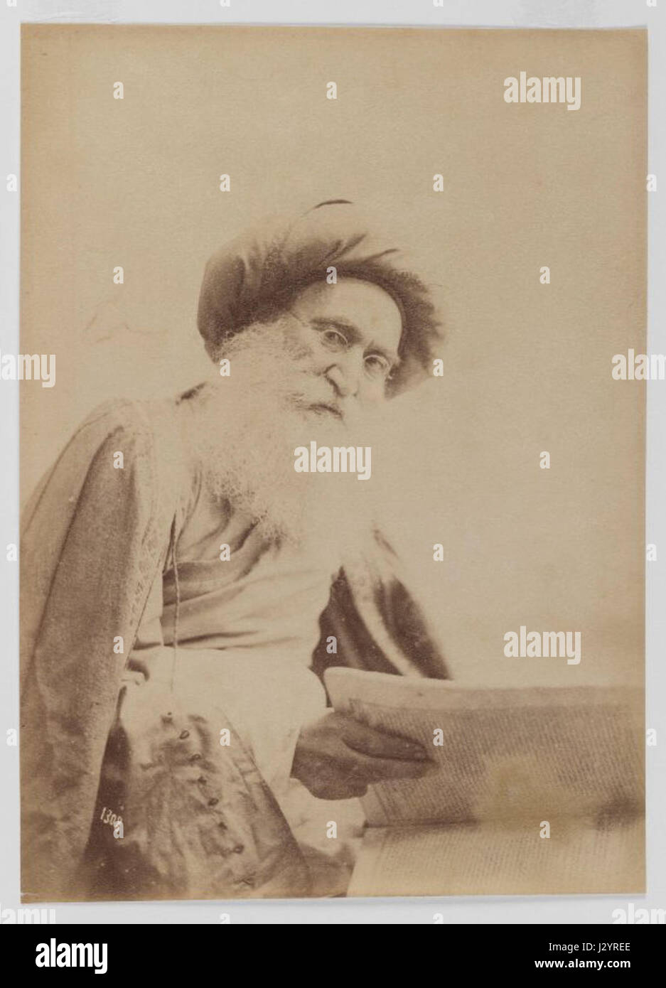 A photographic portrait of Dr. Nur Mahmoud, likely displayed at the ...