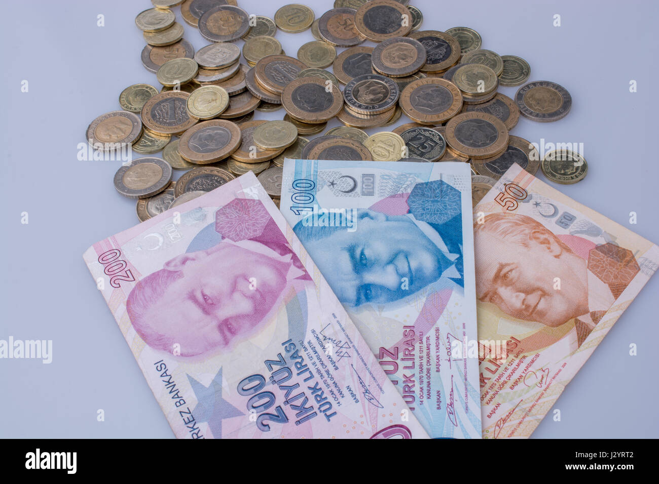Turkish Lira coins and banknotes side by side on white background Stock ...