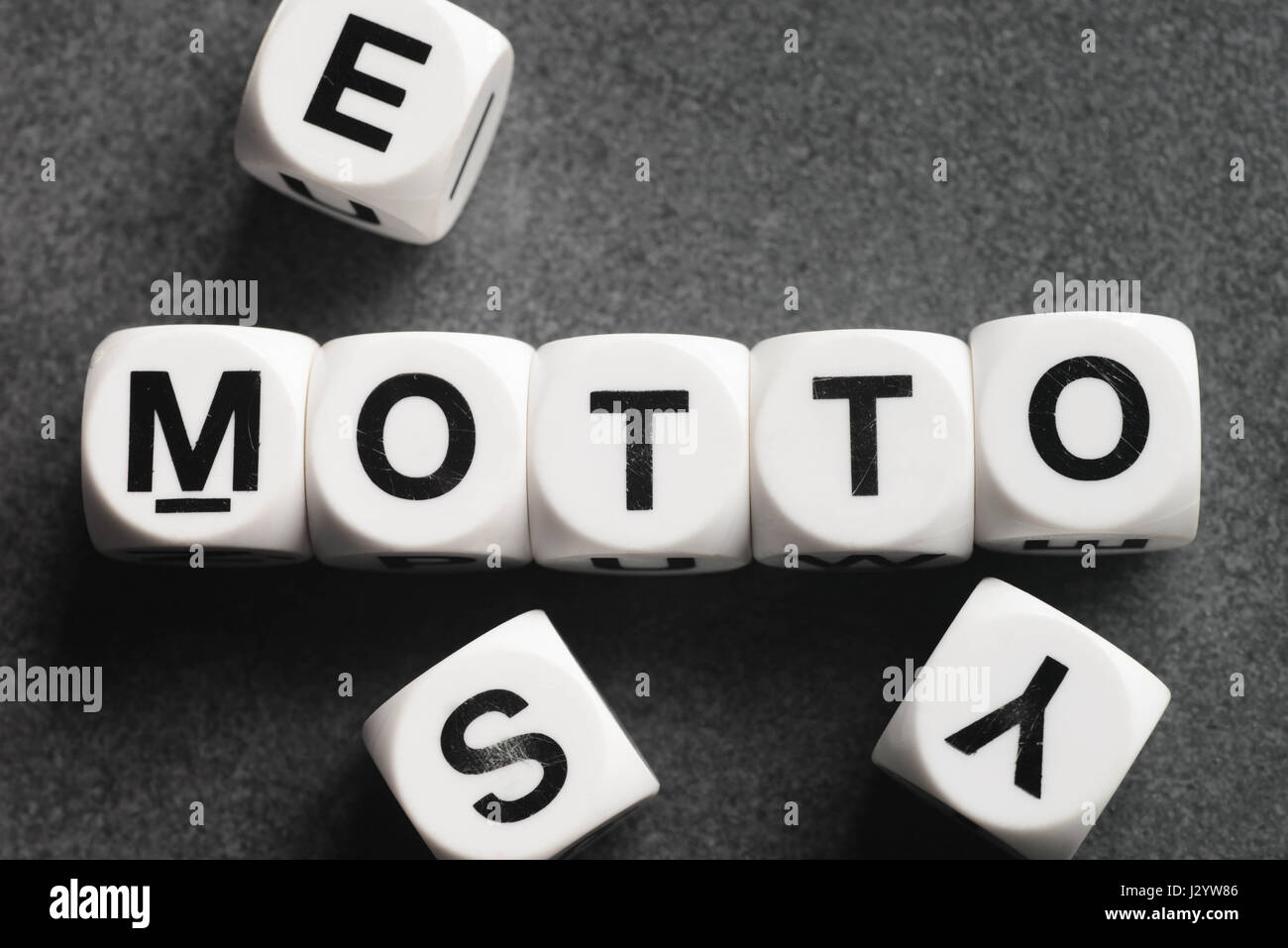 word motto on white toy cubes Stock Photo - Alamy