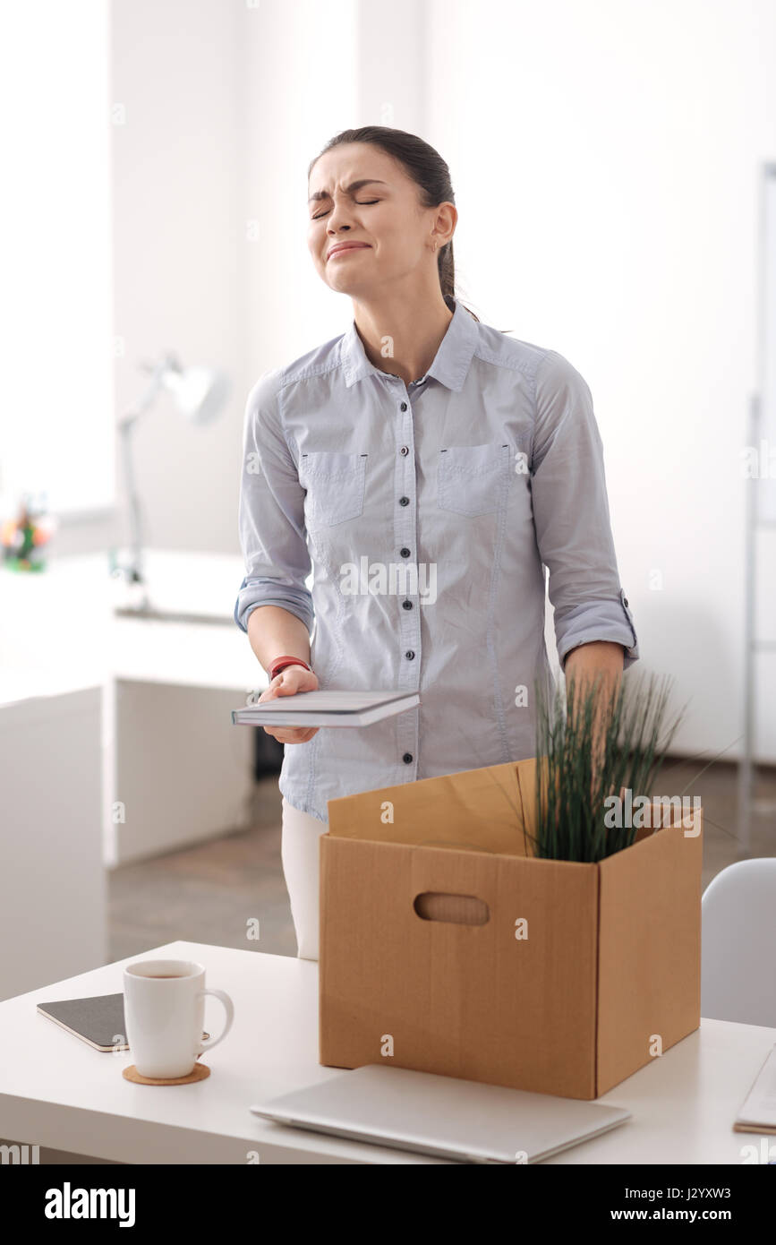 Crying female collecting her things Stock Photo - Alamy