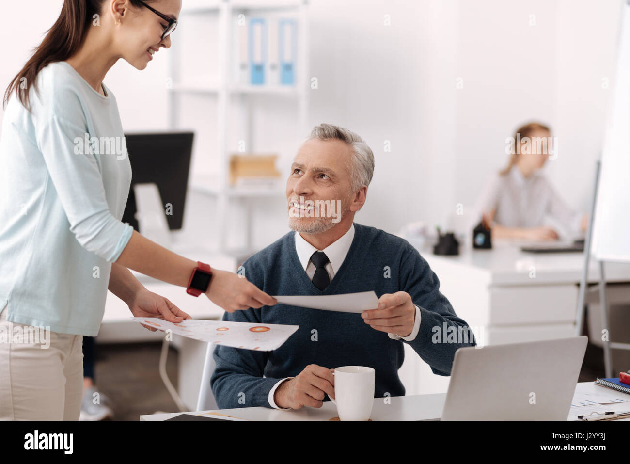 Handsome bearded man taking paper Stock Photo - Alamy