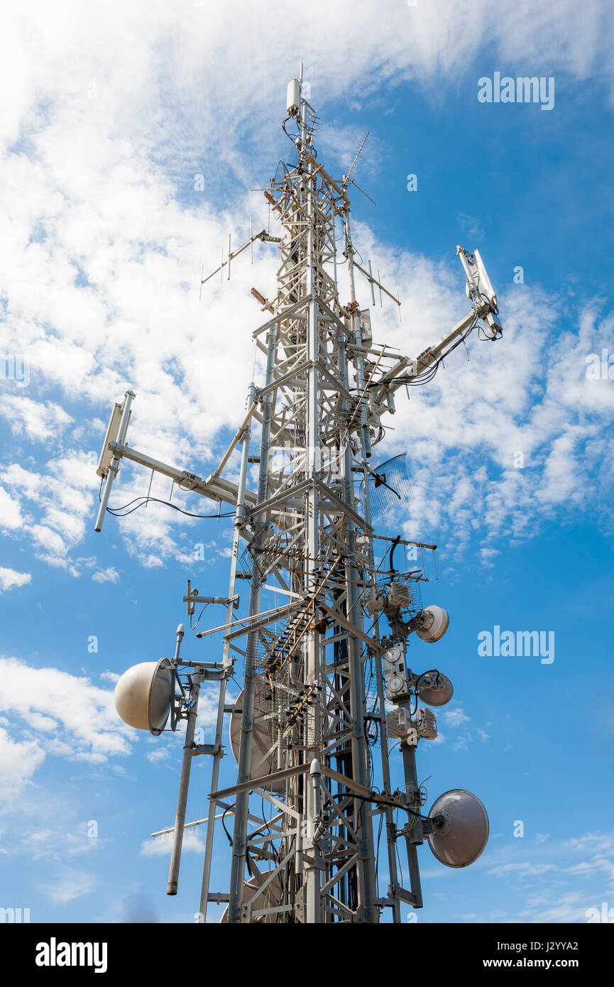Telecommunication antenna tower against the blue sky Stock Photo - Alamy
