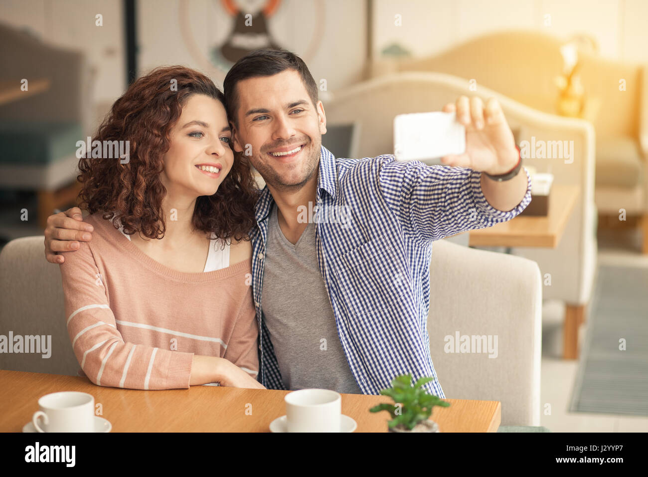 Nice looking couple in cafe Stock Photo - Alamy