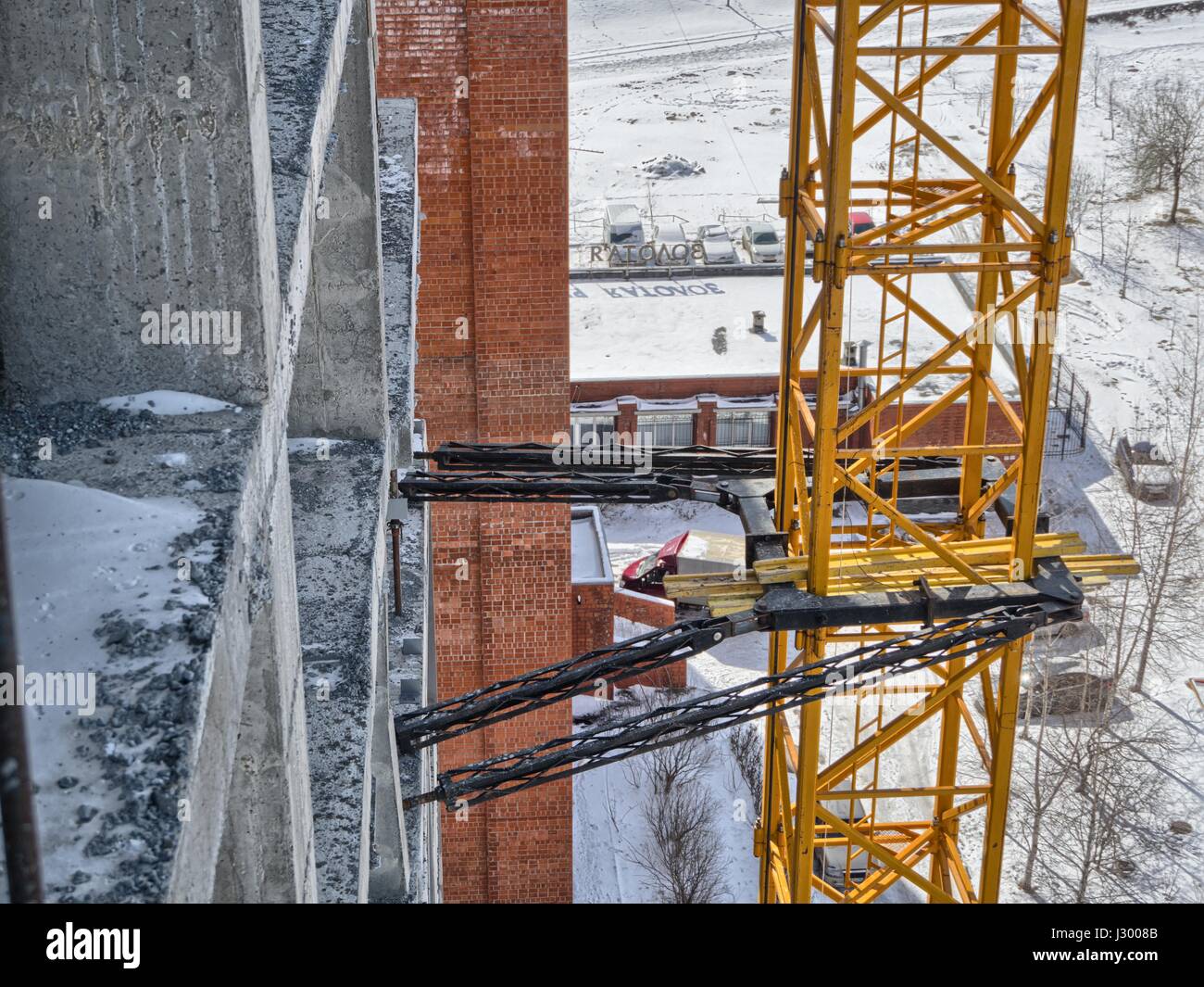 Crane attached to building Stock Photo - Alamy