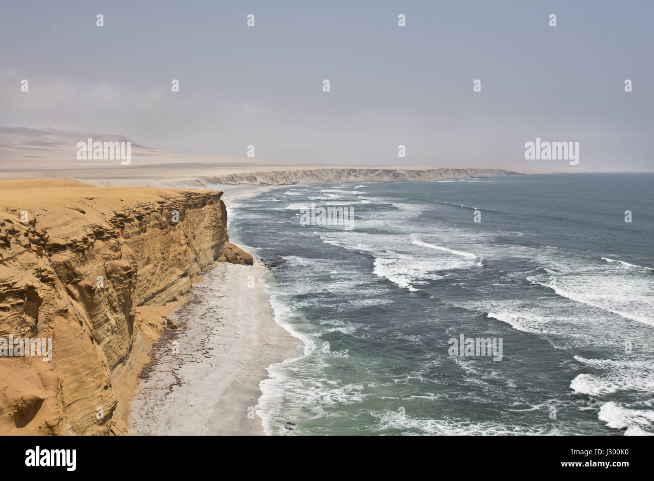 Rocky cliff and ocean with surf. Perfect place to see tropical desert ...