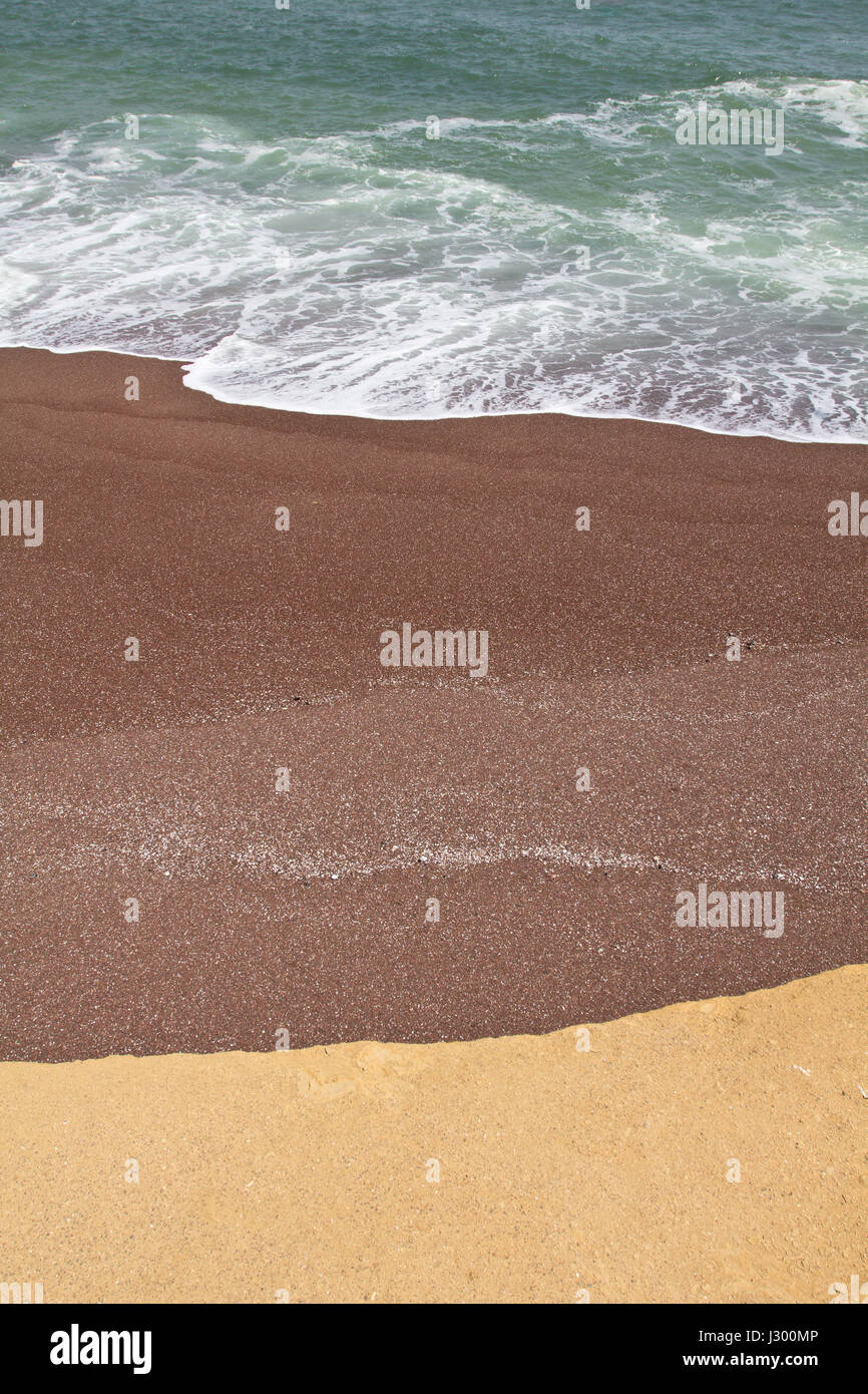 Rocky cliff and ocean with surf. Perfect place to see tropical desert ...