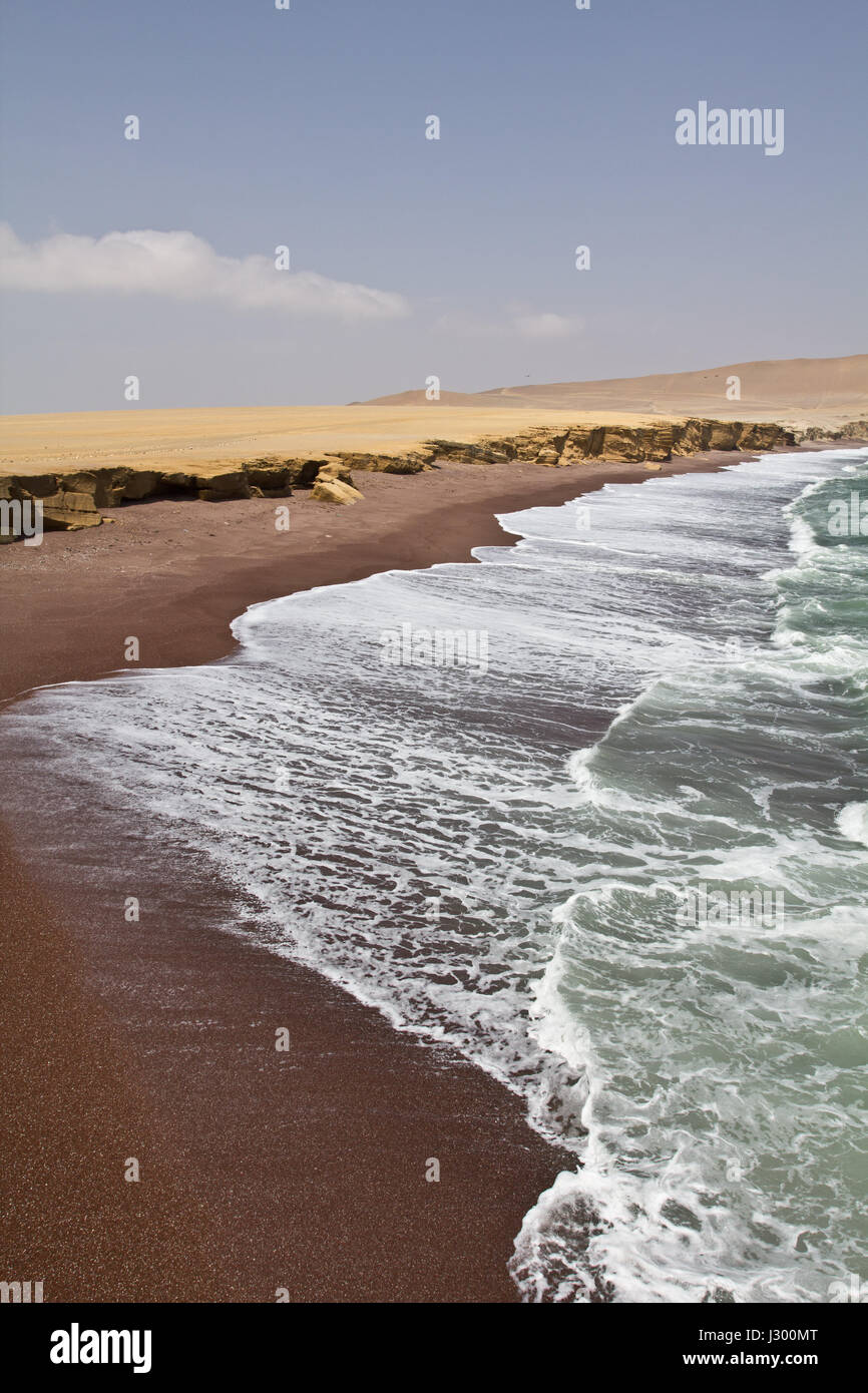Rocky cliff and ocean with surf. Perfect place to see tropical desert ...