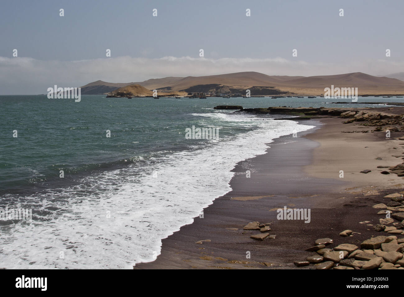 Rocky cliff and ocean with surf. Perfect place to see tropical desert ...