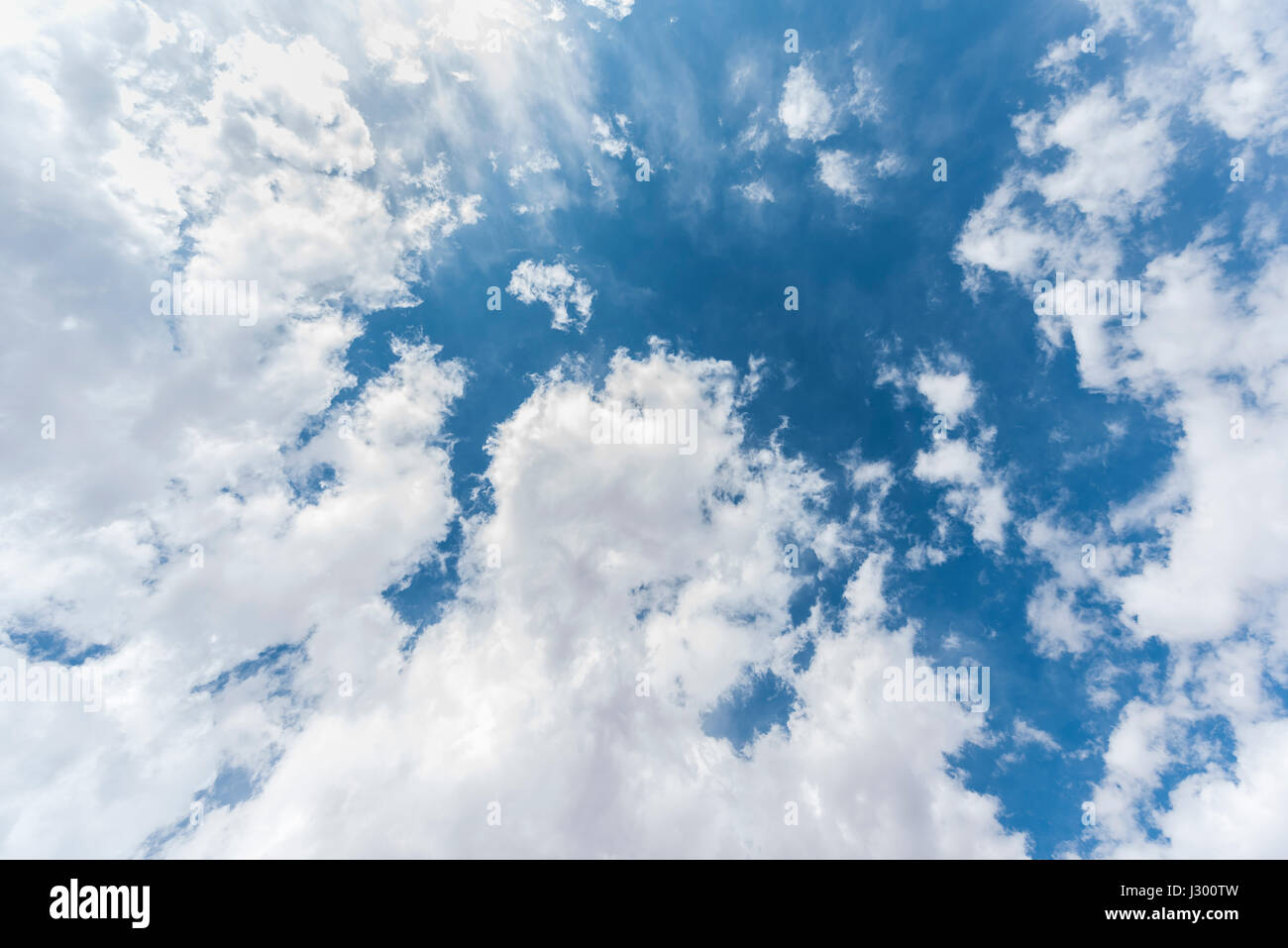 Vertical skyscape of blue sky background with clouds Stock Photo - Alamy
