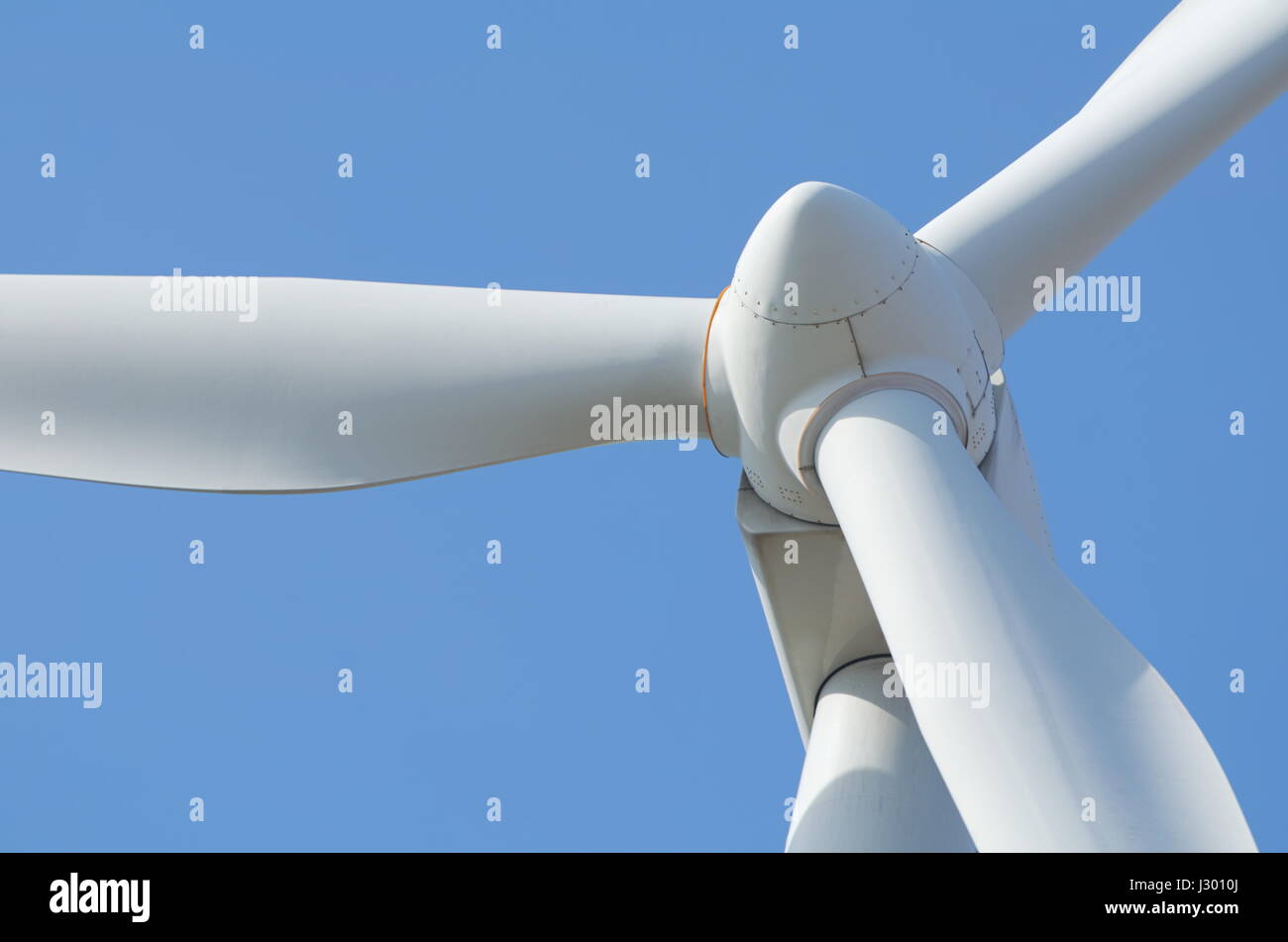 White Wind Turbine on Blue Sky Closeup Stock Photo - Alamy