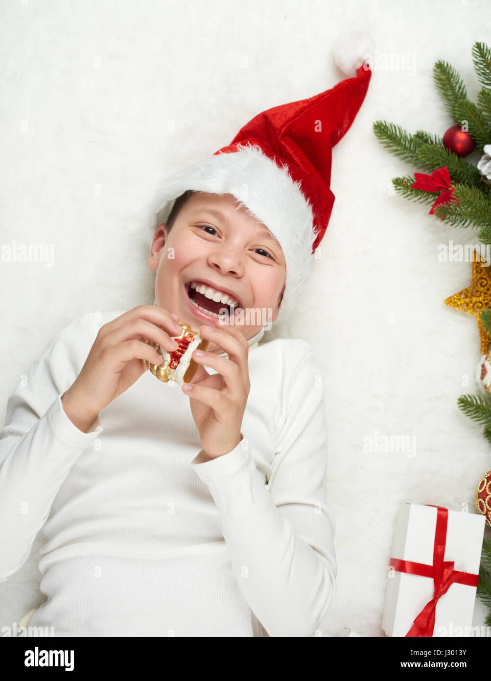 boy child having fun with christmas decoration, face expression and ...